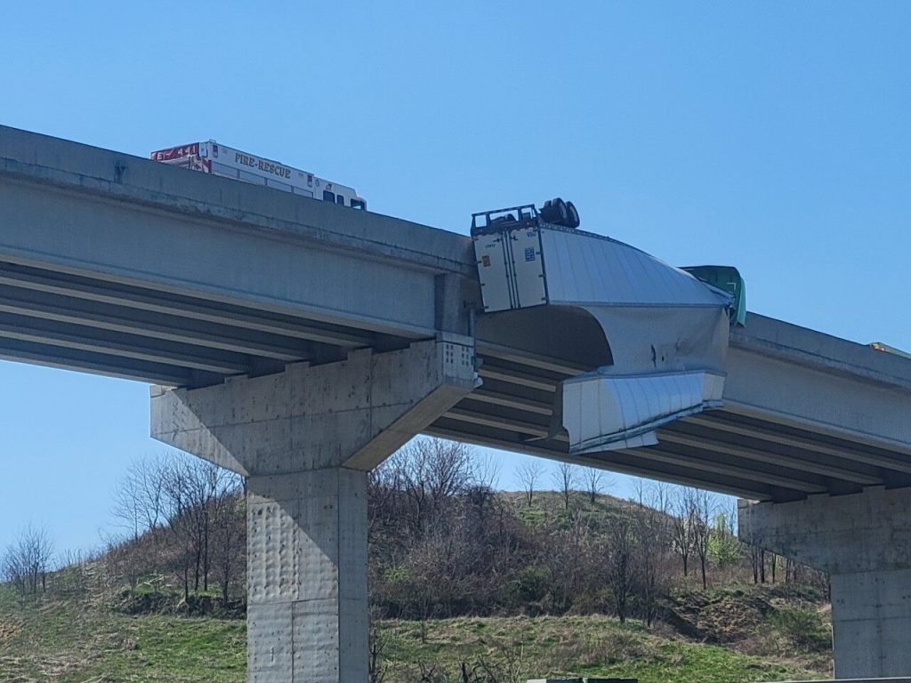 I-79 flyover ramp shut down; rig hanging from overpass - Herald-Standard
